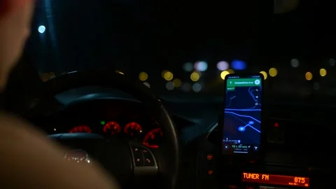 Night Driver Woman turn a wheel, use Goo... | Stock Video | Pond5