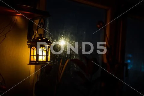 Photograph: Night scene of stars seen through the window from dark room ...