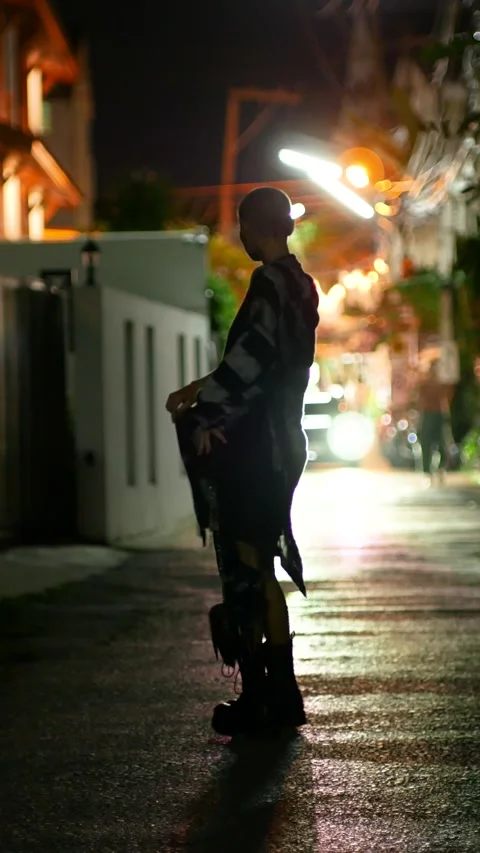 Night Stroll: Stylish Woman in Kimono Ex... | Stock Video | Pond5