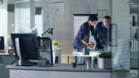 At Night Three Design Engineers Work at ... | Stock Video | Pond5