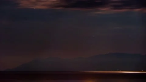 Night time lapse with moon light rays sh... | Stock Video | Pond5