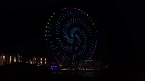 Night view of the Dubai Eye with light s... | Stock Video | Pond5
