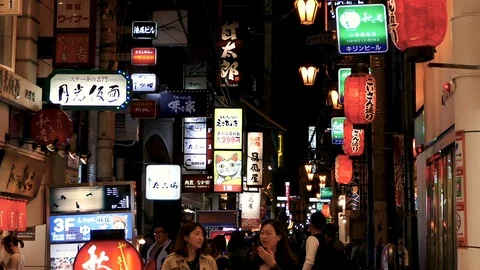 Nightlife with neon lights on back alley... | Stock Video | Pond5