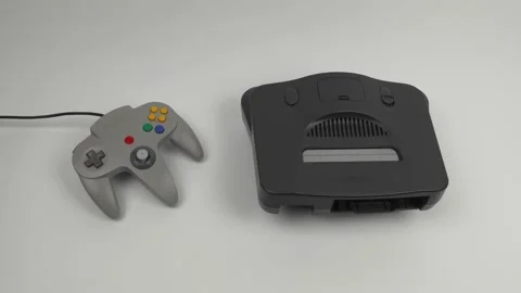 Nintendo 64 gray console spining with co... | Stock Video | Pond5