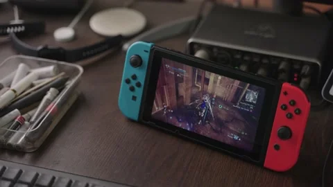 A Nintendo Switch controller on top of a... | Stock Video | Pond5