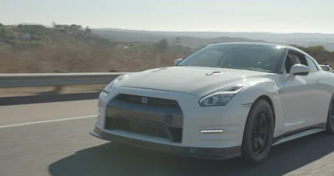 Nissan GTR Speeds Past Camera | Stock Video | Pond5