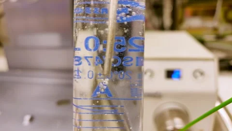 Nitrogen bubble through organic solvent ... | Stock Video | Pond5