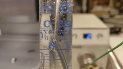 Nitrogen bubble through organic solvent ... | Stock Video | Pond5