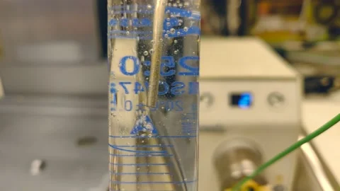 Nitrogen bubble through organic solvent ... | Stock Video | Pond5