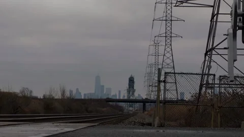 NJ Powerlines and Railroad With NYC Skyl... | Stock Video | Pond5