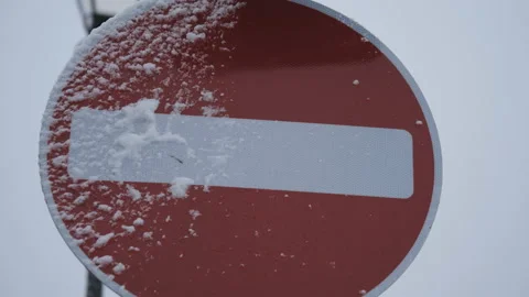 No entry road sign post during a snowfa... | Stock Video | Pond5