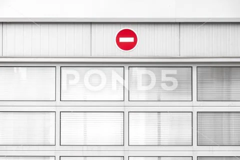 Photograph: No entry traffic sign on gray industrial wall #113562527