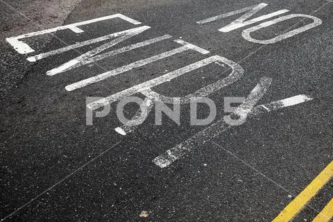 No Entry, white text road marking Stock Image ~ #135943306