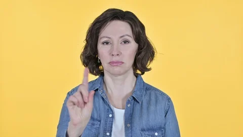No, Finger Sign by Old Woman on Yellow B... | Stock Video | Pond5