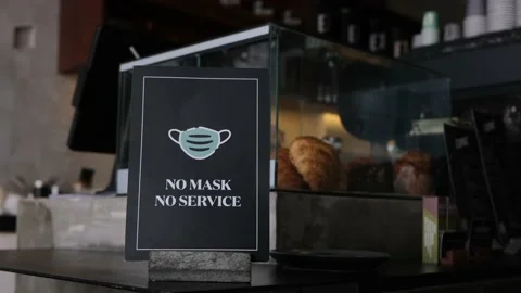 No mask no service warning sign in cafe ... | Stock Video | Pond5