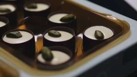Noble Belgian chocolate cups sweets with... | Stock Video | Pond5