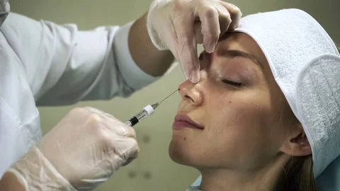 Non-surgical correction of shape of a no... | Stock Video | Pond5