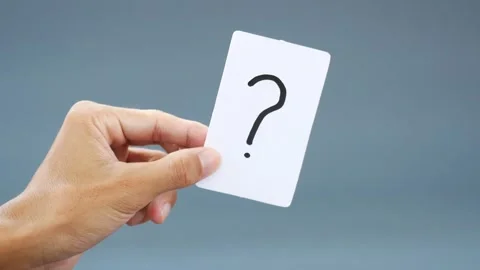 Note paper in hand holds paper with a qu... | Stock Video | Pond5