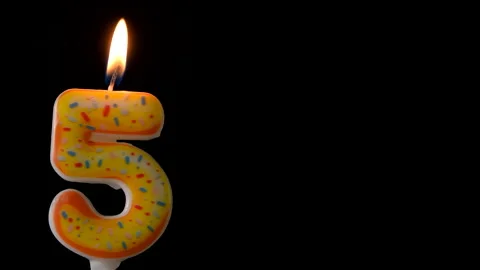 Number 5 donut candle a black background | Stock Video | Pond5