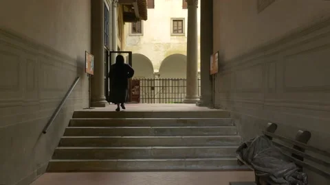 Nun climbing the staircase inside the Sa... | Stock Video | Pond5