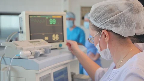 Nurse check the patient`s vital signs on... | Stock Video | Pond5