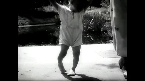 Nurse examine bone of baby legs - 1939 | Stock Video | Pond5