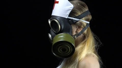 Nurse girl in gas mask | Stock Video | Pond5