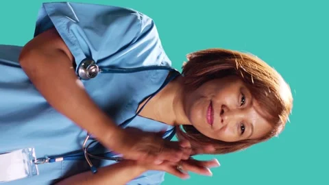Nurse happily clapping hands | Stock Video | Pond5
