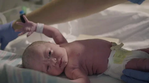 Nurse in Hospital puts First Diaper on N... | Stock Video | Pond5
