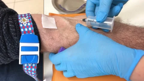 Nurse inserts needle into vein for drip ... | Stock Video | Pond5