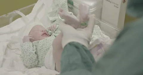 Nurse put on white disposable diaper on ... | Stock Video | Pond5