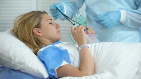 Nurse wearing female patient oxygen mask... | Stock Video | Pond5