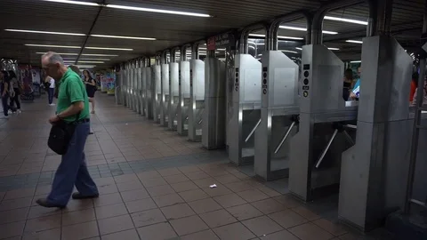 NYC subway riders swipe metro cards thro... | Stock Video | Pond5