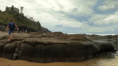 The ocean flows into rock opening at a b... | Stock Video | Pond5