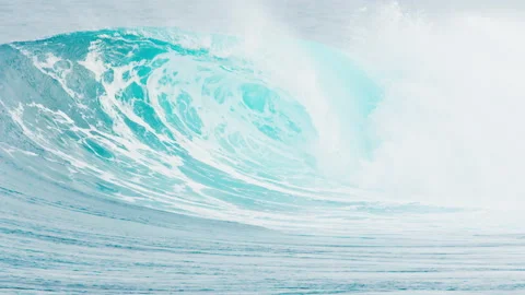 Ocean wave breaks in on the reef in the ... | Stock Video | Pond5