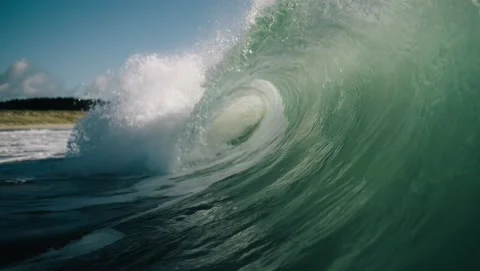 Ocean wave rolling into shore looping ba... | Stock Video | Pond5