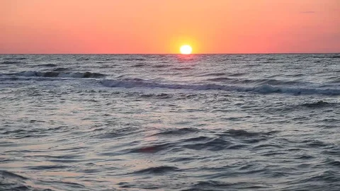 Ocean wave water surface with rising sun... | Stock Video | Pond5