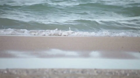 ocean waves washing beach sand. | Stock Video | Pond5