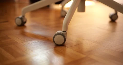 Office chair legs with small wheels on a... | Stock Video | Pond5