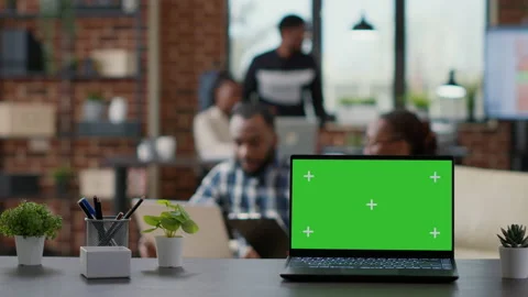 Office desk with green screen on laptop ... | Stock Video | Pond5