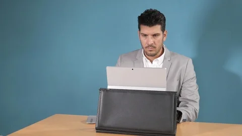 Office Man finished his work, stands up ... | Stock Video | Pond5