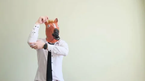 Office worker in horse mask dancing at w... | Stock Video | Pond5