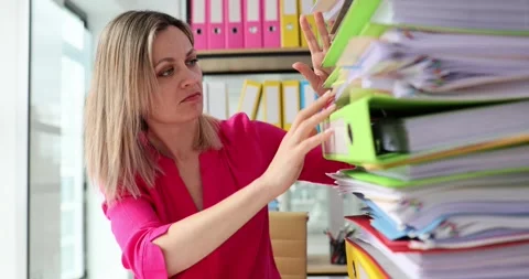 Office worker looking for necessary file... | Stock Video | Pond5