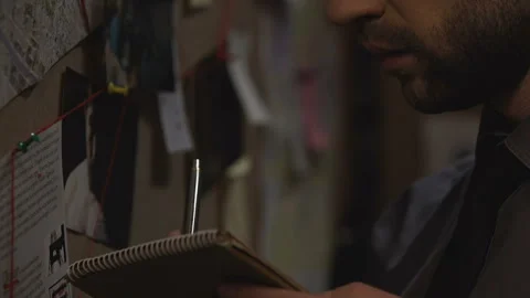 Officer looking at city map and making n... | Stock Video | Pond5