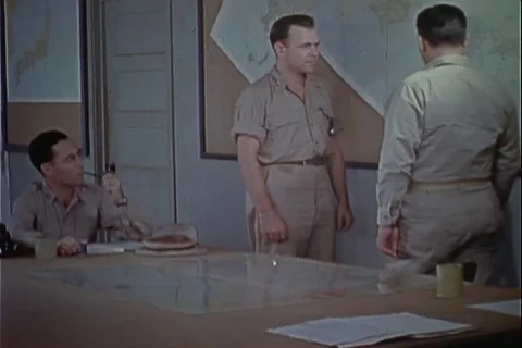 Officer sits back on table and instructo... | Stock Video | Pond5