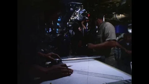 Officers plot a course on a chart aboard... | Stock Video | Pond5