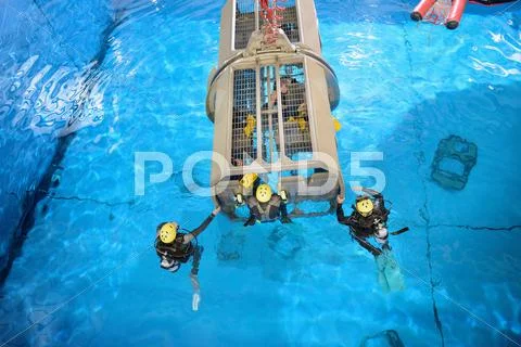 Offshore Oil Workers In Simulated Helicopter, Being Trained In Sea ...