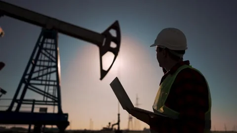 Oil industry. Engineer worker makes note... | Stock Video | Pond5