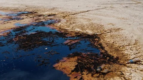 Oil polution in water next to Oil well p... | Stock Video | Pond5