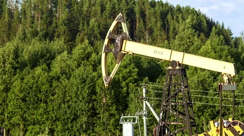 Oil pump on the forest background | Stock Video | Pond5